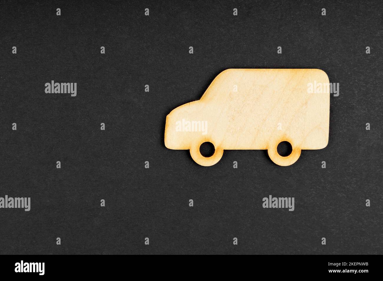 Transport and business concept. Wooden lorry on a black background ...