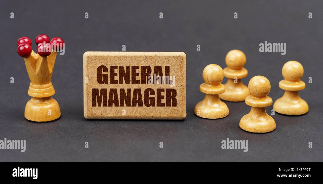 Business concept. On a black background, chess and a sign with the ...