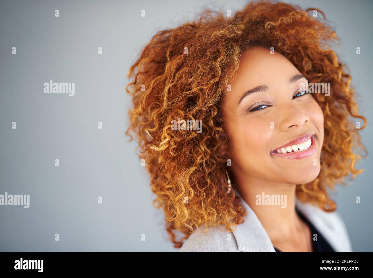 Smiling her way to success. Studio portrait of a young businesswoman ...