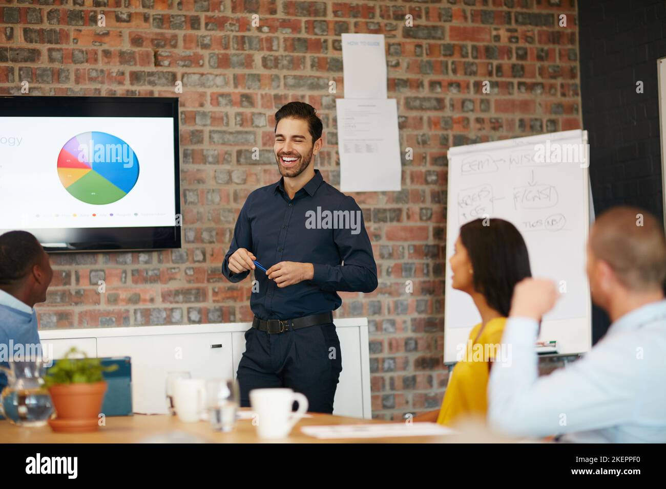 Getting positive responses to his presentation. a young businessman ...