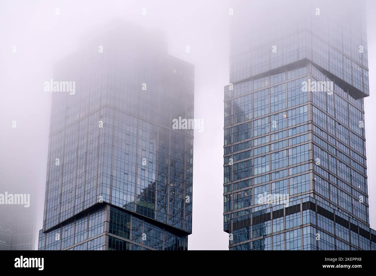 Windows of skyscrapers in the fog, background copy space. Metal ...