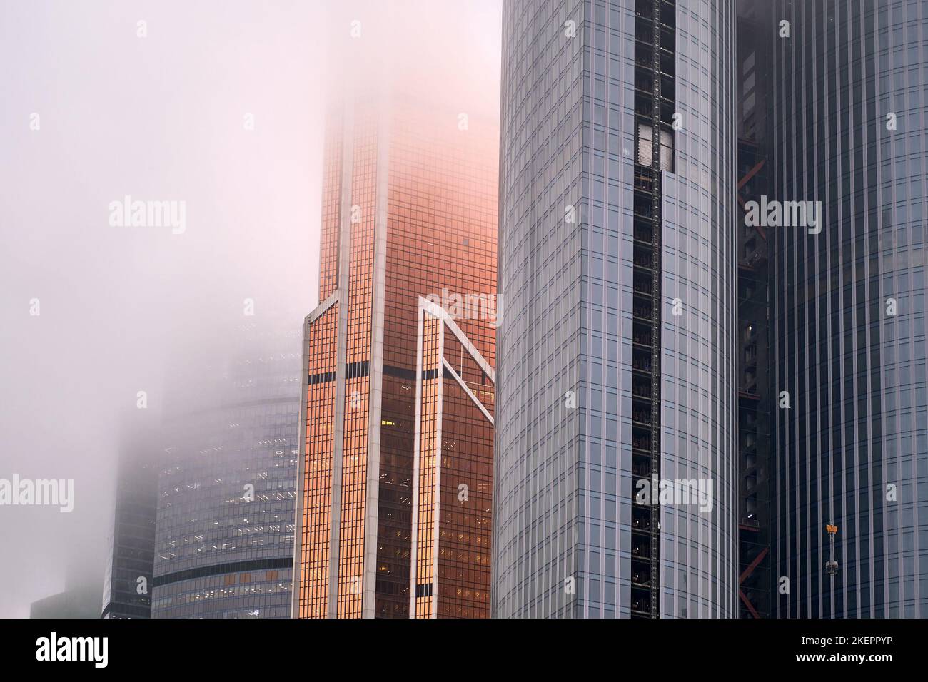 Windows of skyscrapers in the fog, background copy space. Metal ...