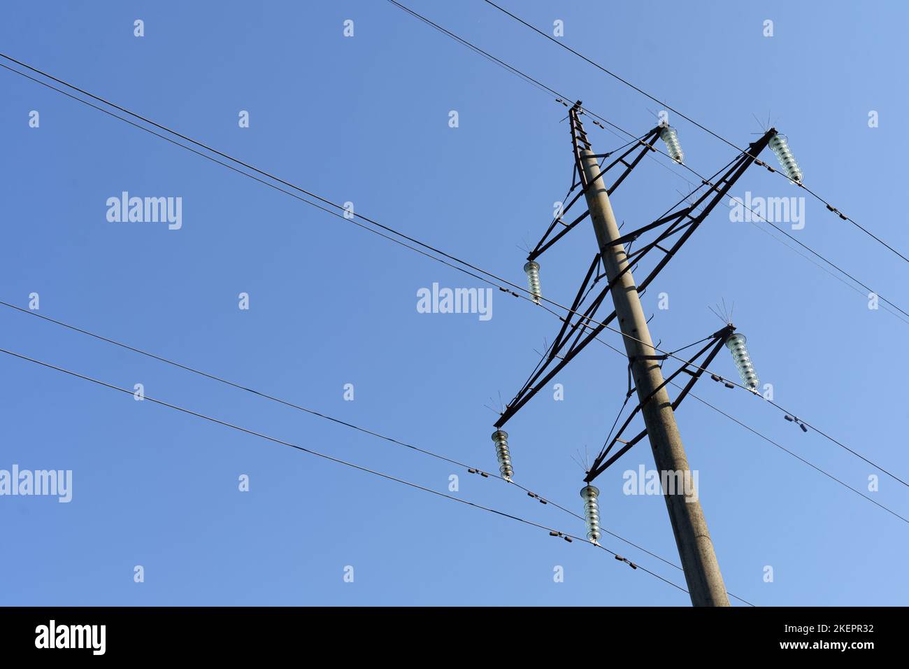 Energy concept. Power line distribution pole against the blue sky Stock ...