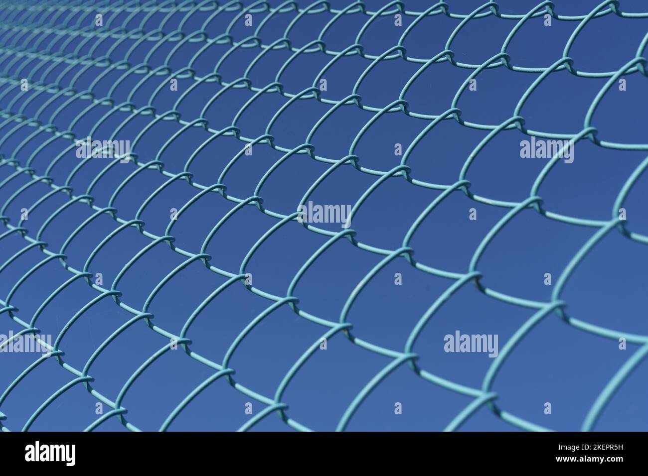 Security and texture. Against the background of a blue sky, a mesh ...