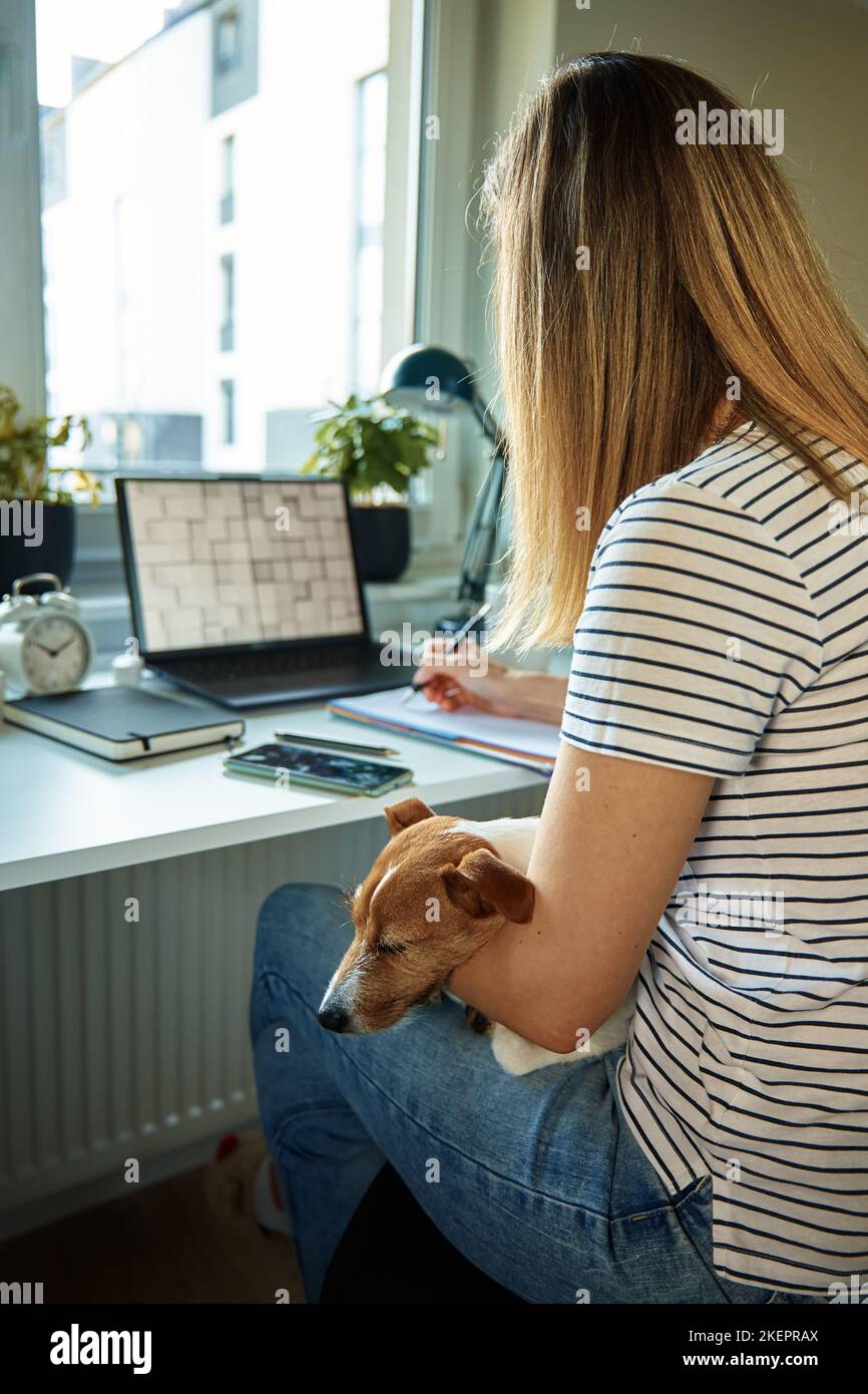 Home office workplace with laptop. Woman working remotely from home ...