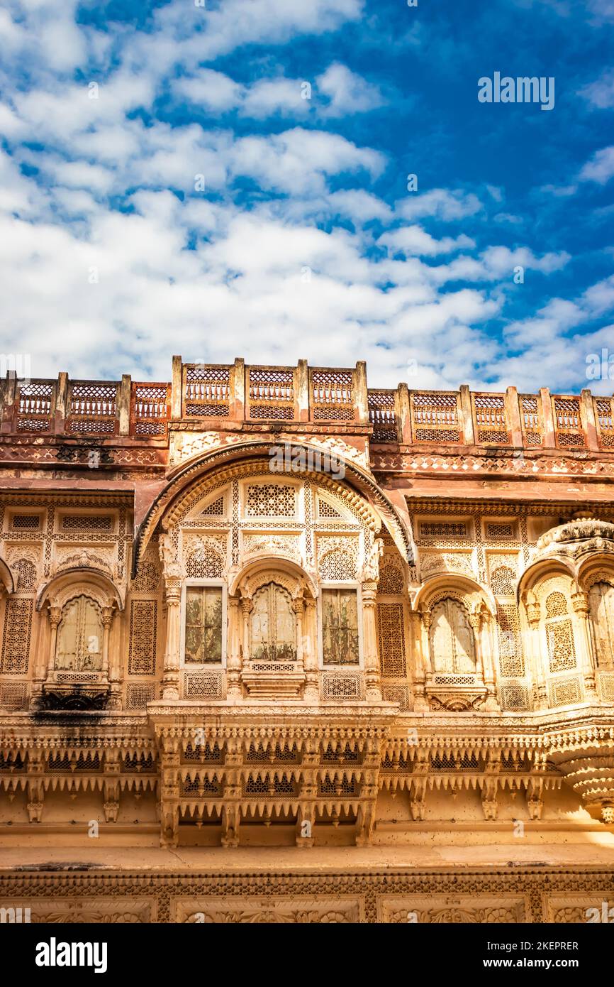 Mehrangarh Fort's facade vintage artistic window with bright blue sky ...