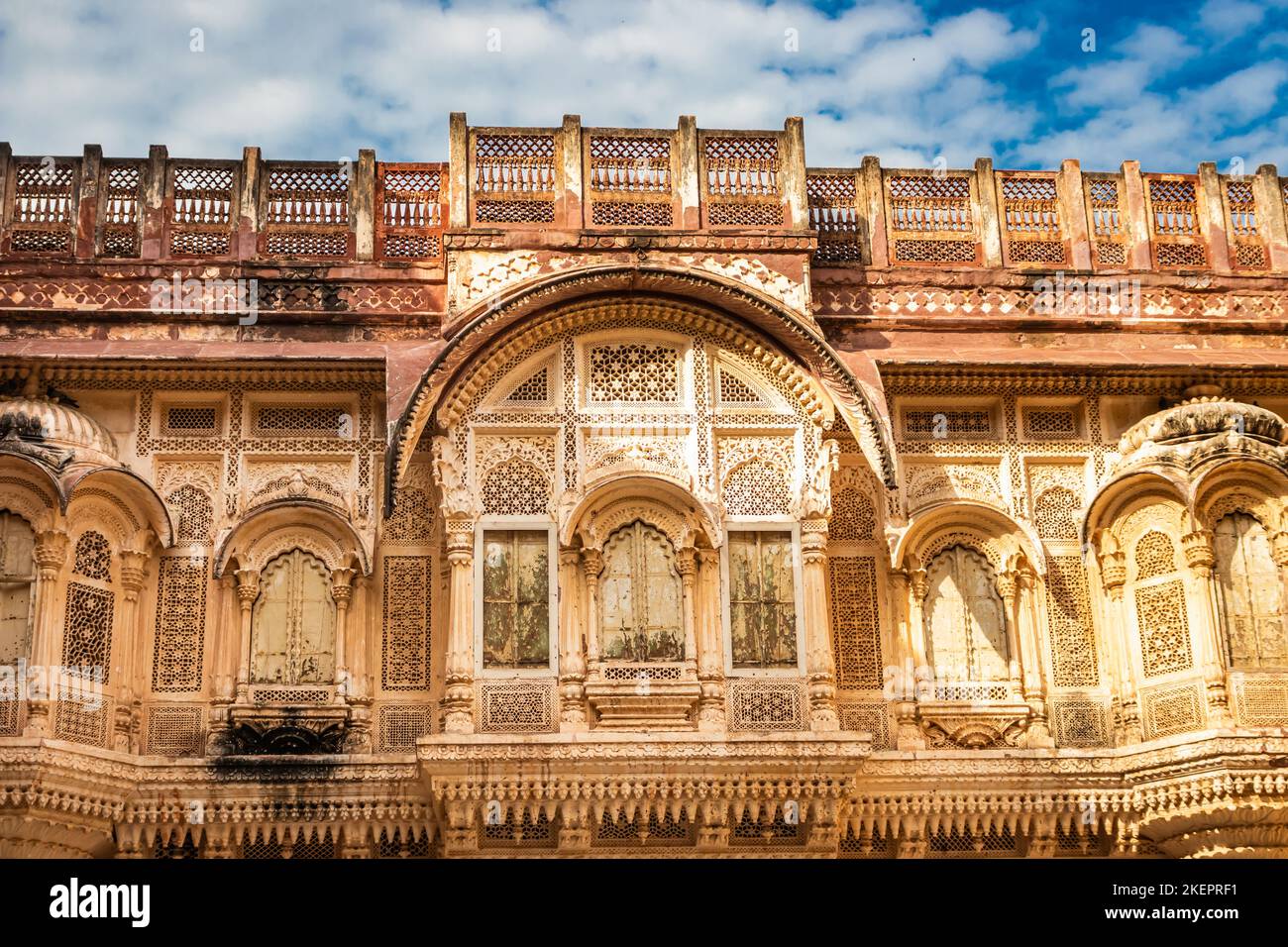 Mehrangarh Fort's facade vintage artistic window with bright blue sky ...
