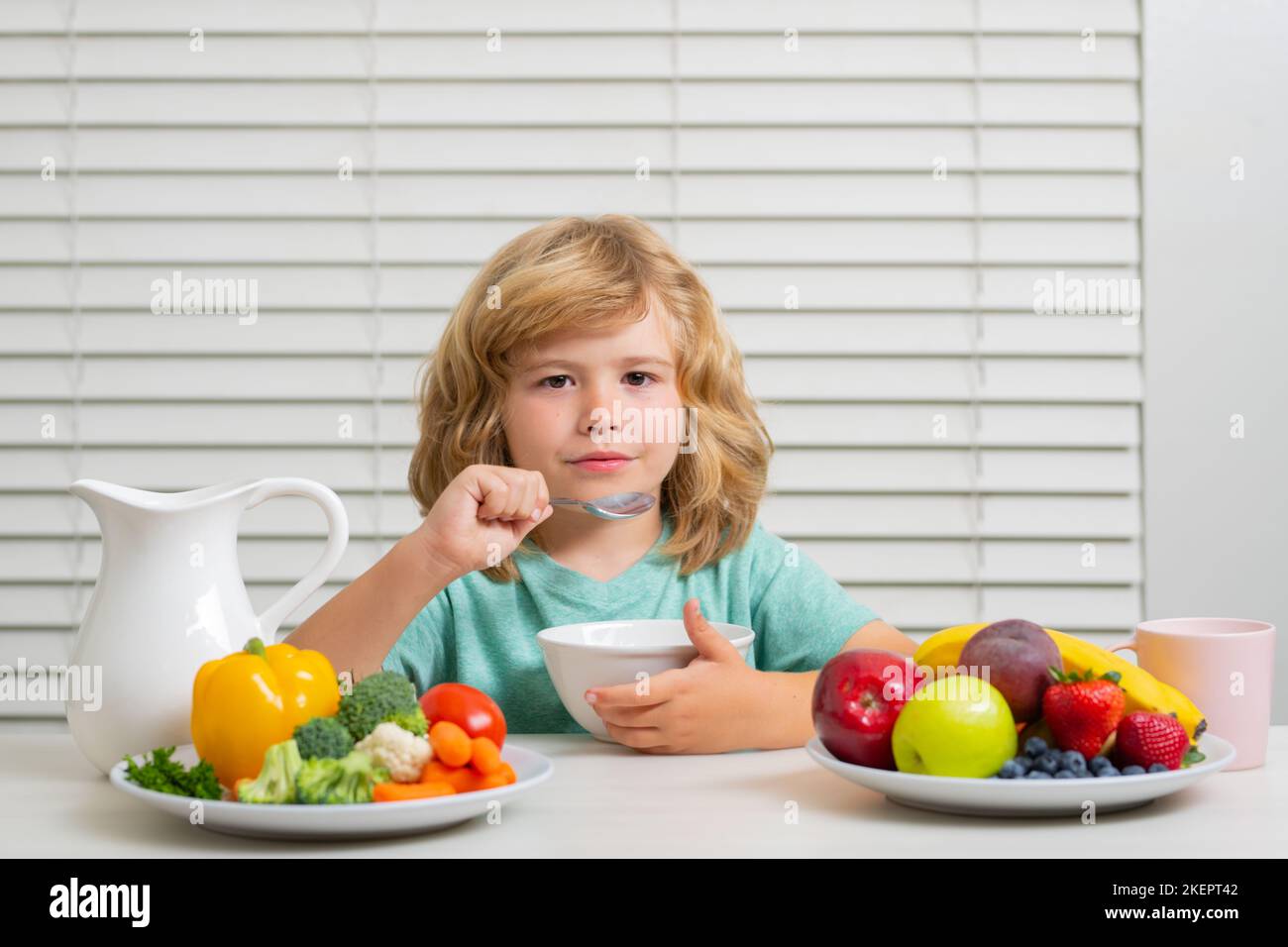 Child eating meal. Healthy nutrition for children. Cute boy enjoy ...