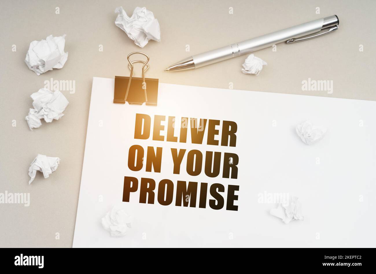 Economy and business concept. On a gray surface, a pen, crumpled paper ...