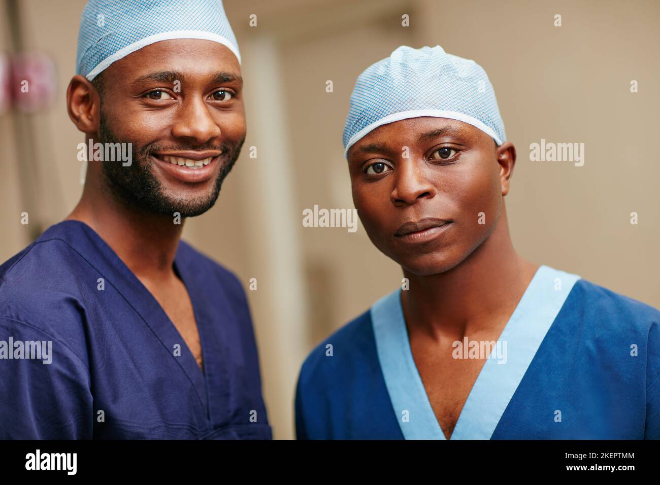 Were ready to assist wherever we can. Cropped portrait of two male ...