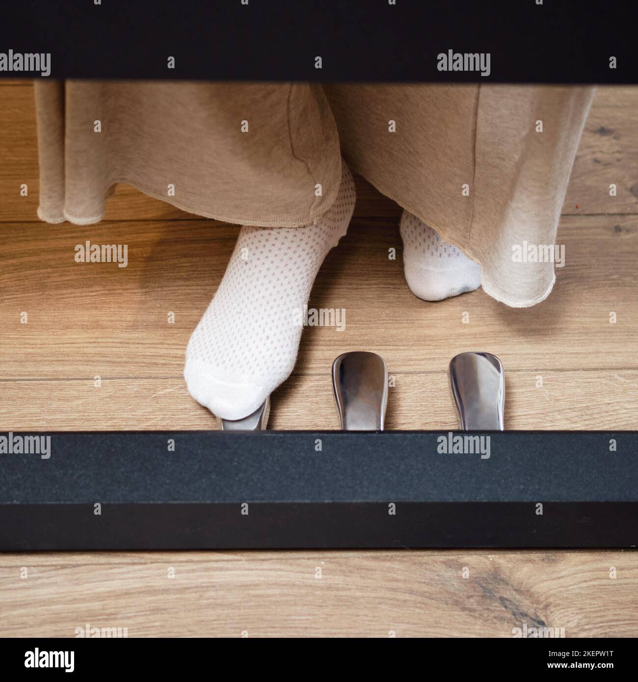 The pianist s foot presses the pedal of the electric piano. Piano and ...