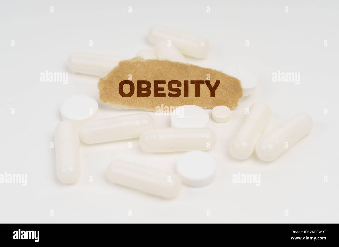 Medicine and health concept. On a white background pills and a piece of ...