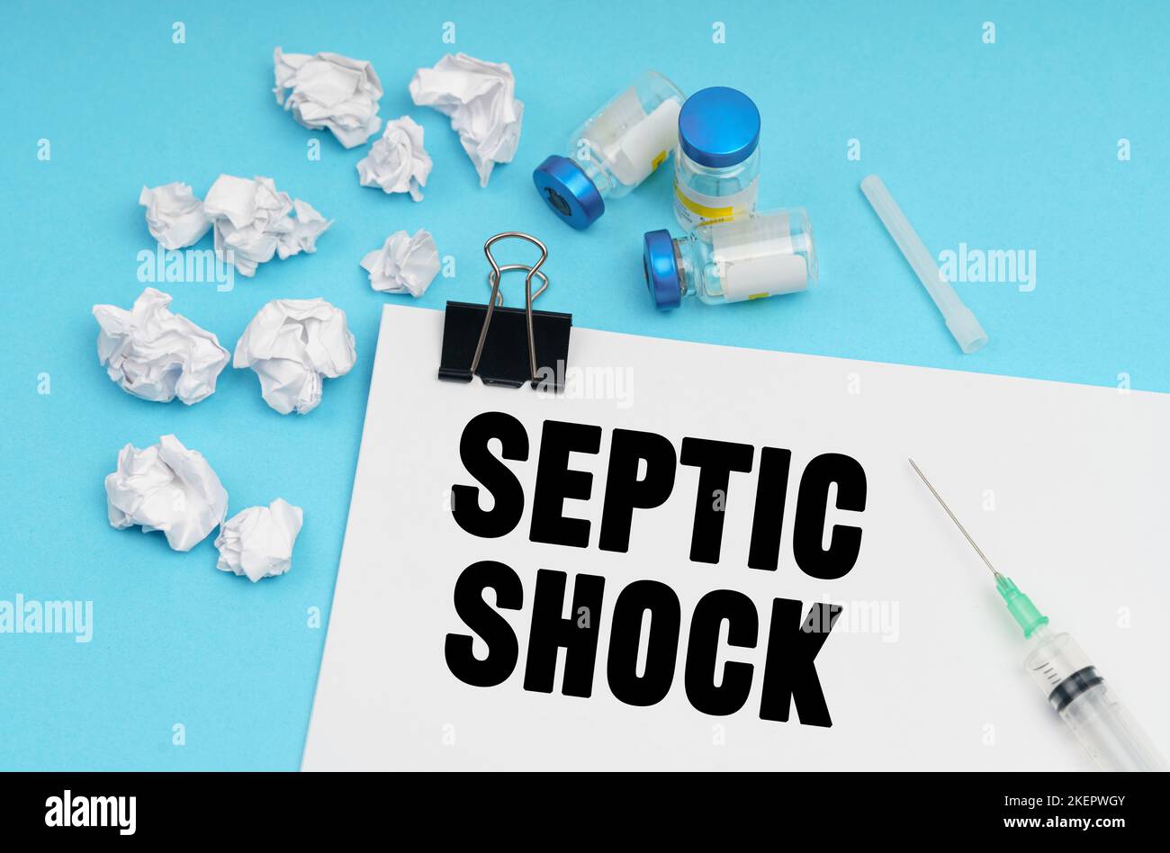 Medicine concept. On a blue background, a syringe, medicine, white ...