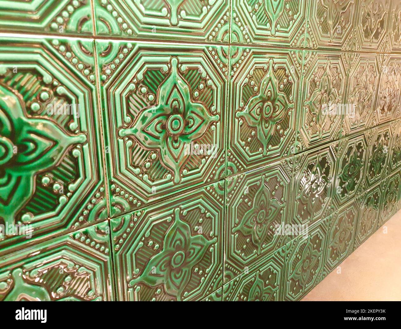 Photograph of green small tiles with floral pattern Stock Photo - Alamy
