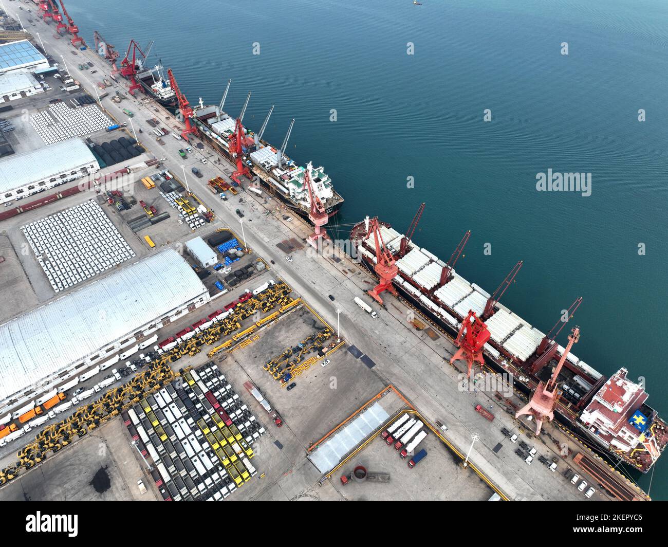 Aerial photo shows the cargo ships loaded with special filling trucks ...