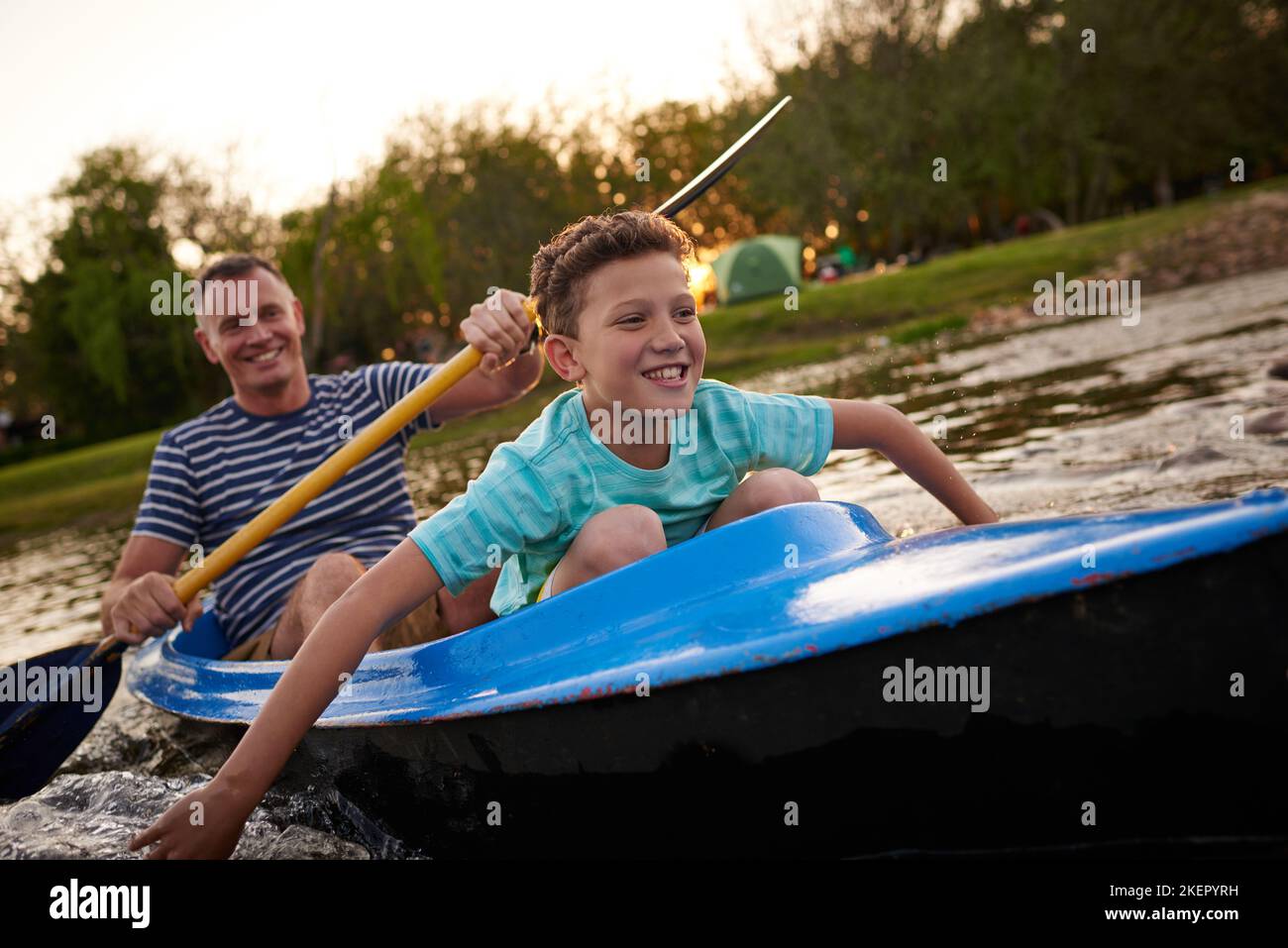 Theyre an adventurous father and son. a father and son rowing a boat ...