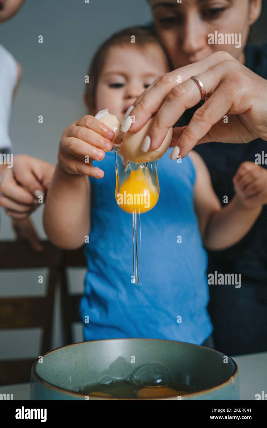 Child cracking egg hi-res stock photography and images - Alamy