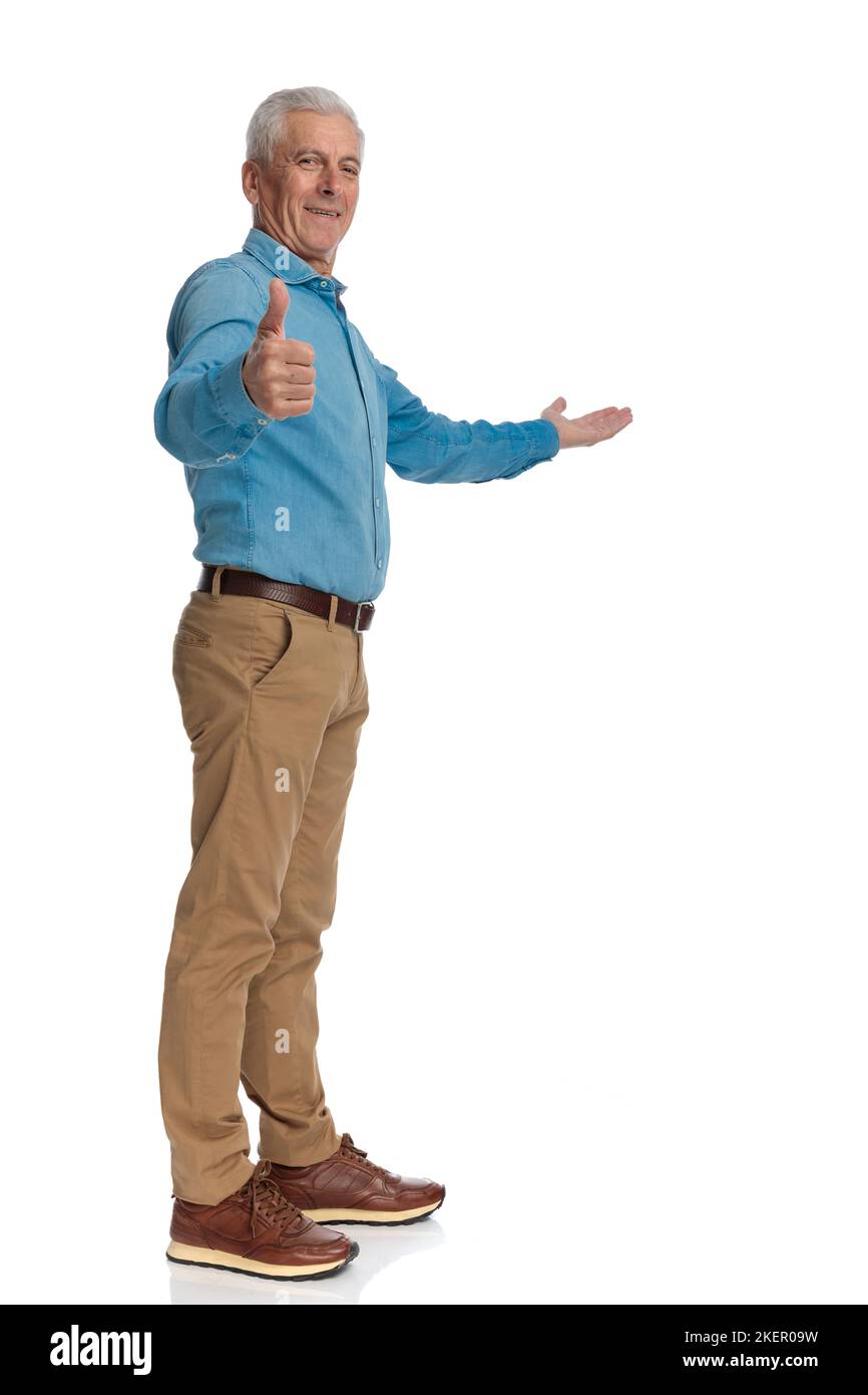 full body picture of casual man with grey hair standing in line ...