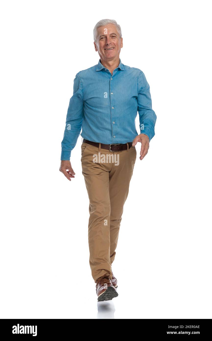 full body picture of happy old man with grizzled hair walking and ...