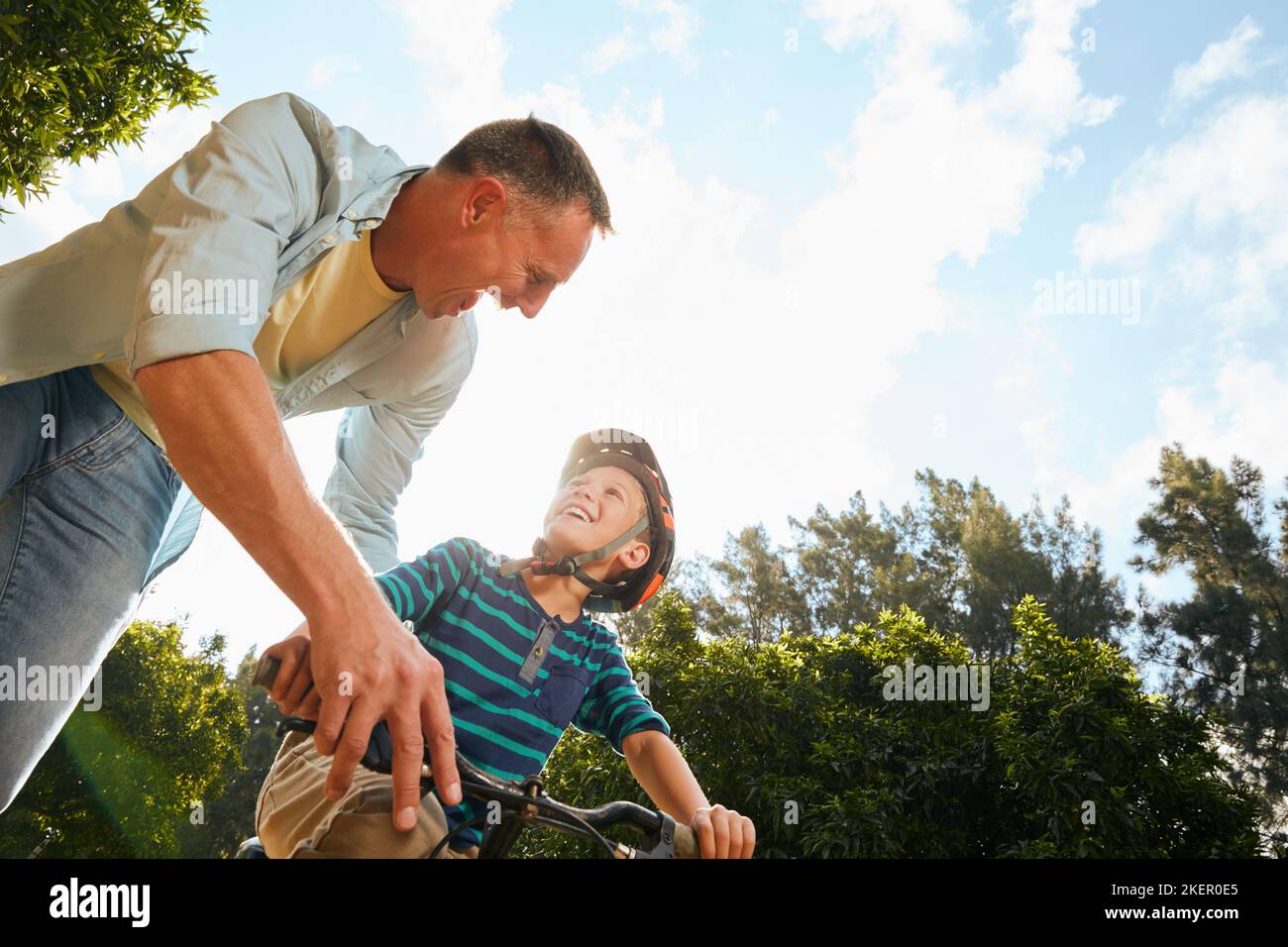 Youll be riding alone in no time. a father teaching his son how to ride ...
