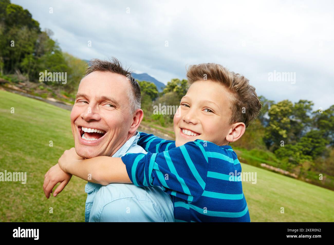 They always have the best time together. Portrait of a dad giving his ...