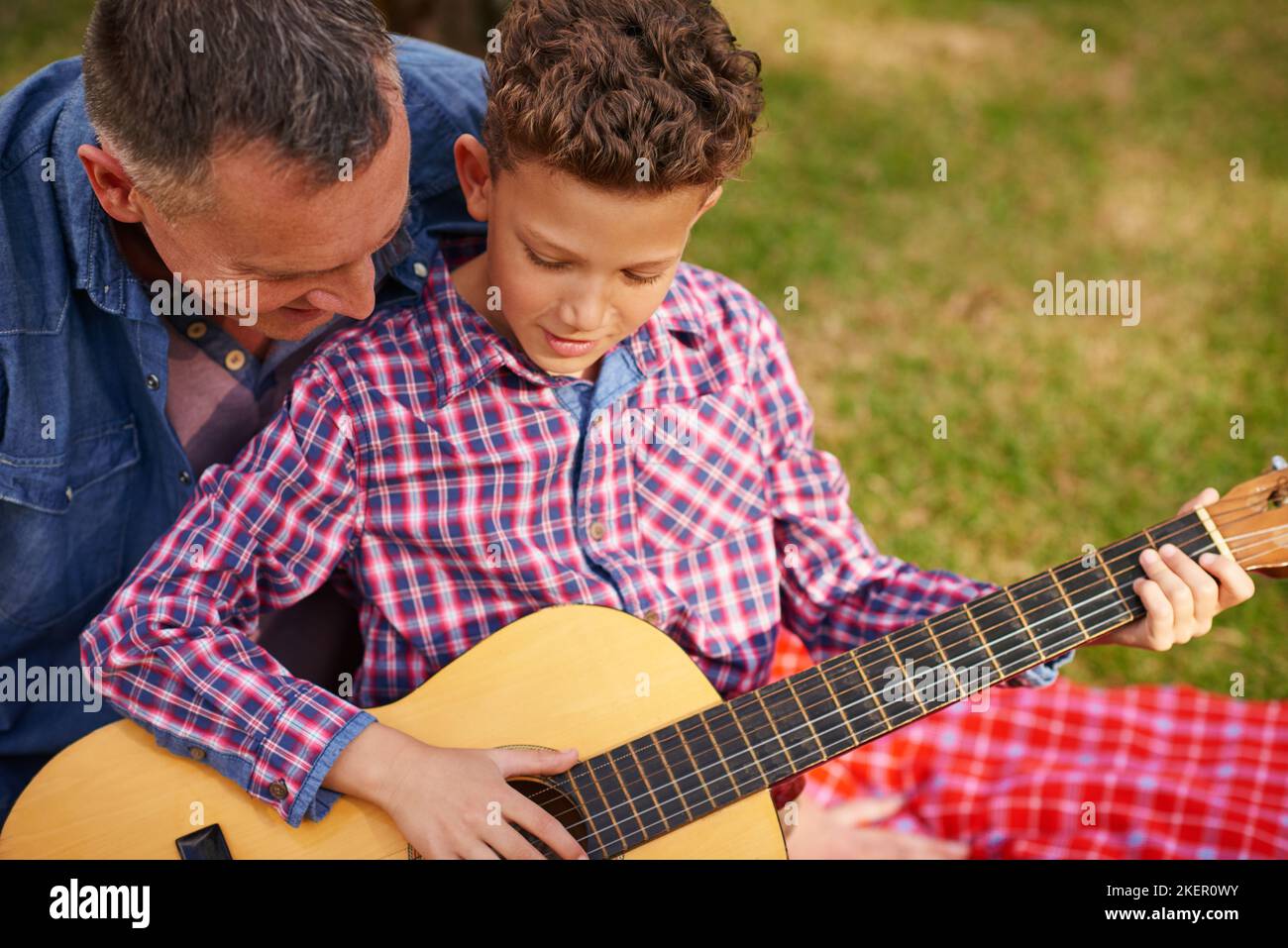 Family playing music outside hi-res stock photography and images - Alamy