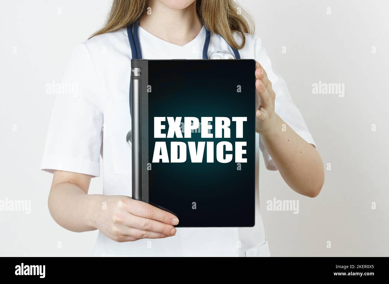 Medicine and health concept. The doctor is holding a tablet with the ...