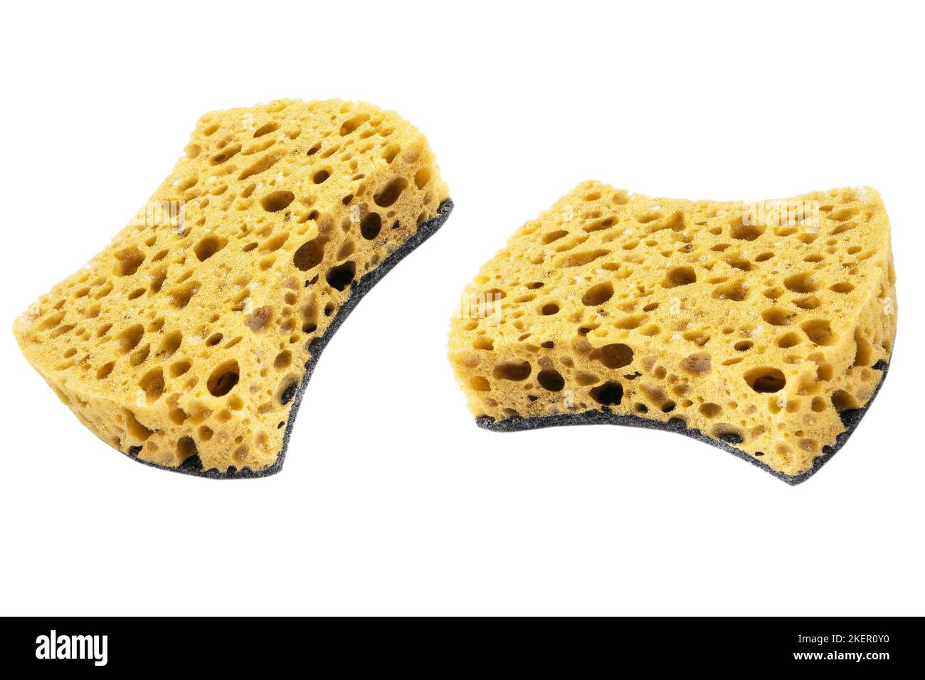 Macro shot of a surface of plastic yellow sponge isolated on white ...