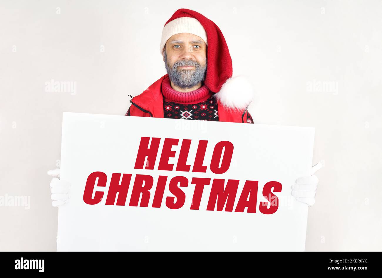 Christmas concept. Santa Claus is holding a sign with the inscription ...