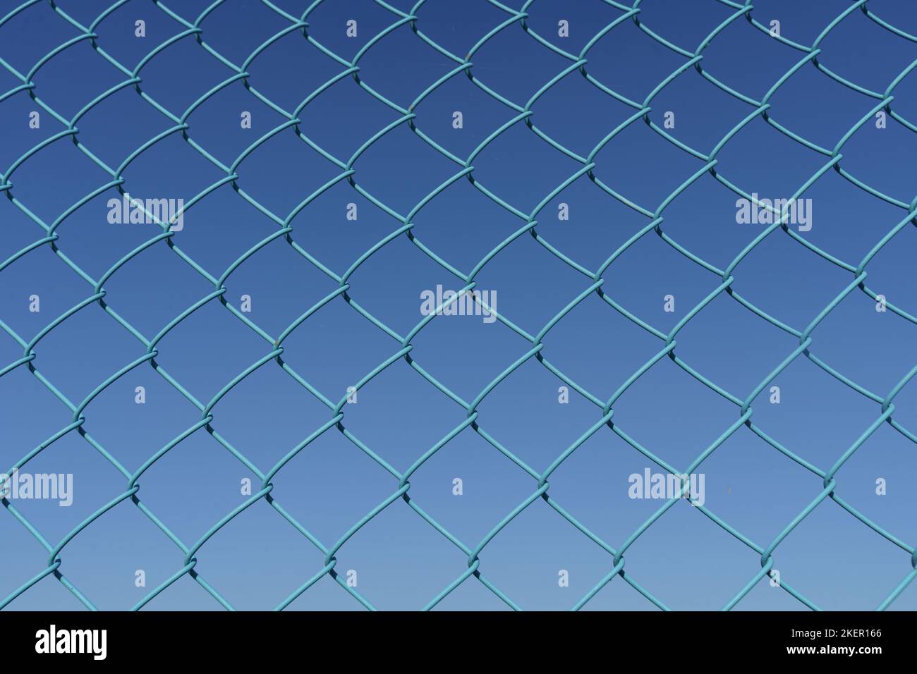 Security and texture. Against the background of a blue sky, a mesh ...