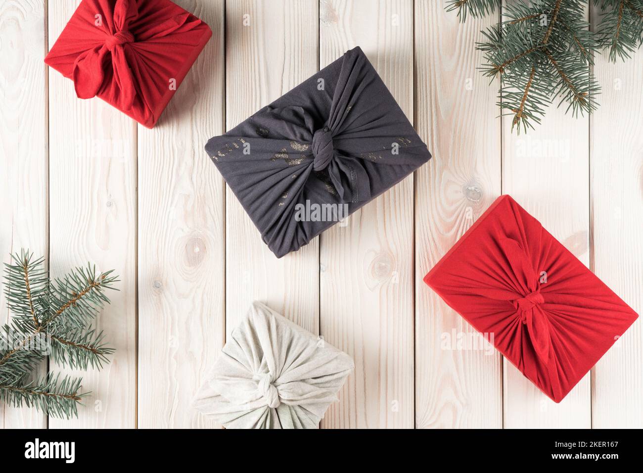 Composition of christmas presents in furoshiki package, top view ...