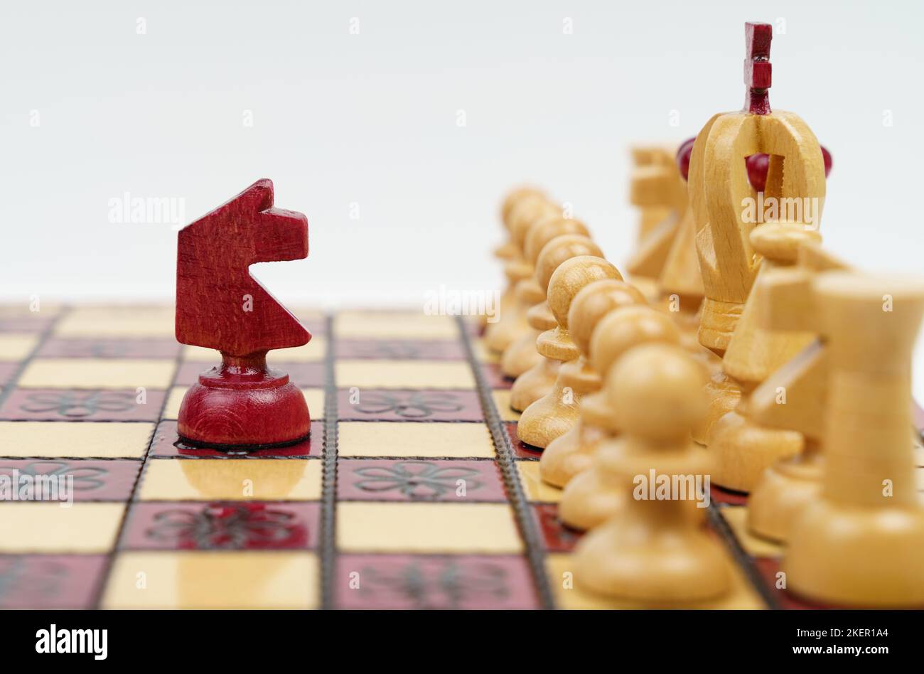 Business and suck concept. On a chess board, a red knight figure ...