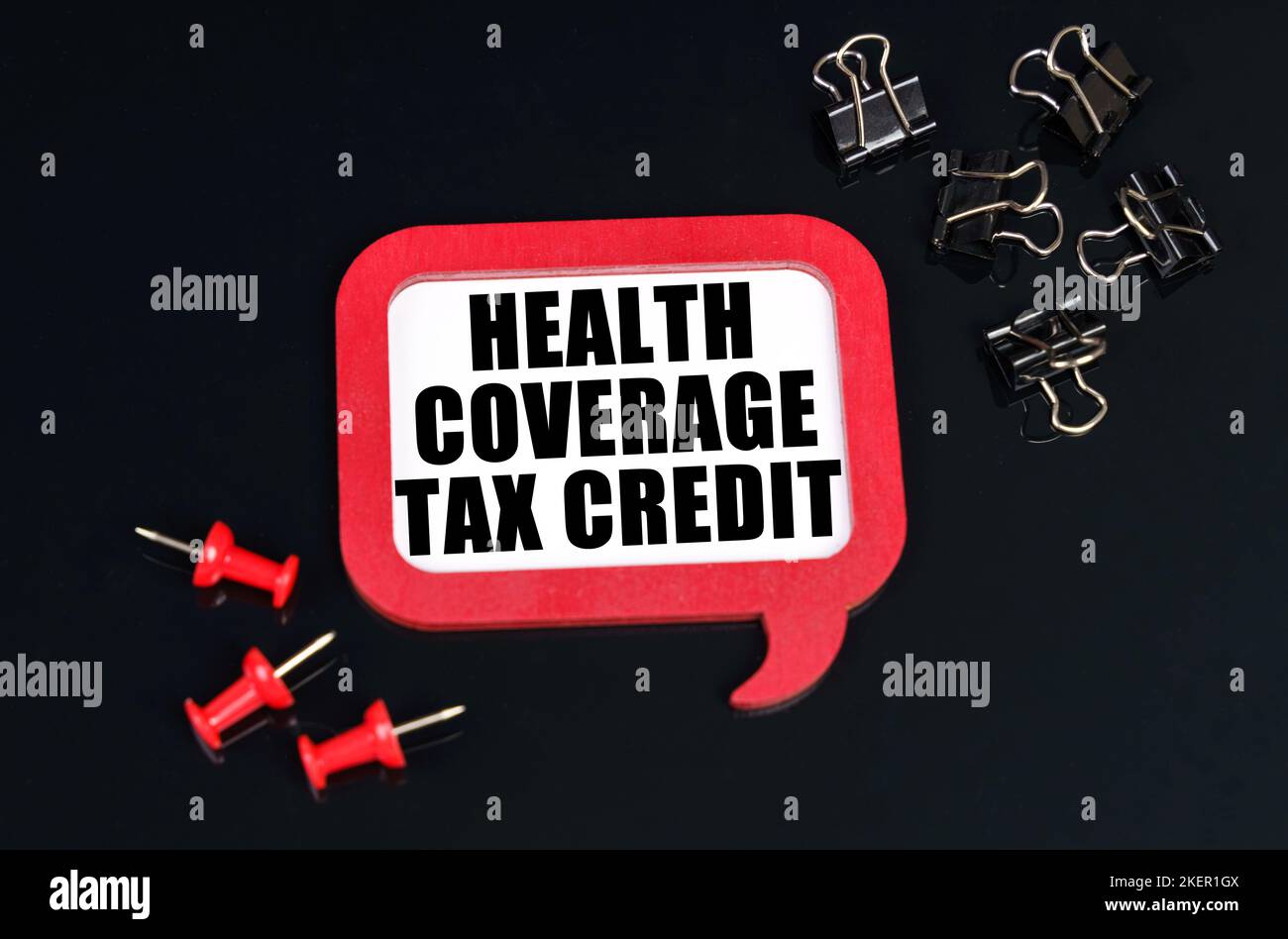 Economy and business concept. On a black surface, office supplies and a ...