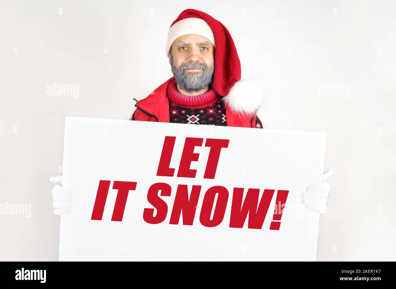 Christmas concept. Santa Claus is holding a sign with the inscription ...