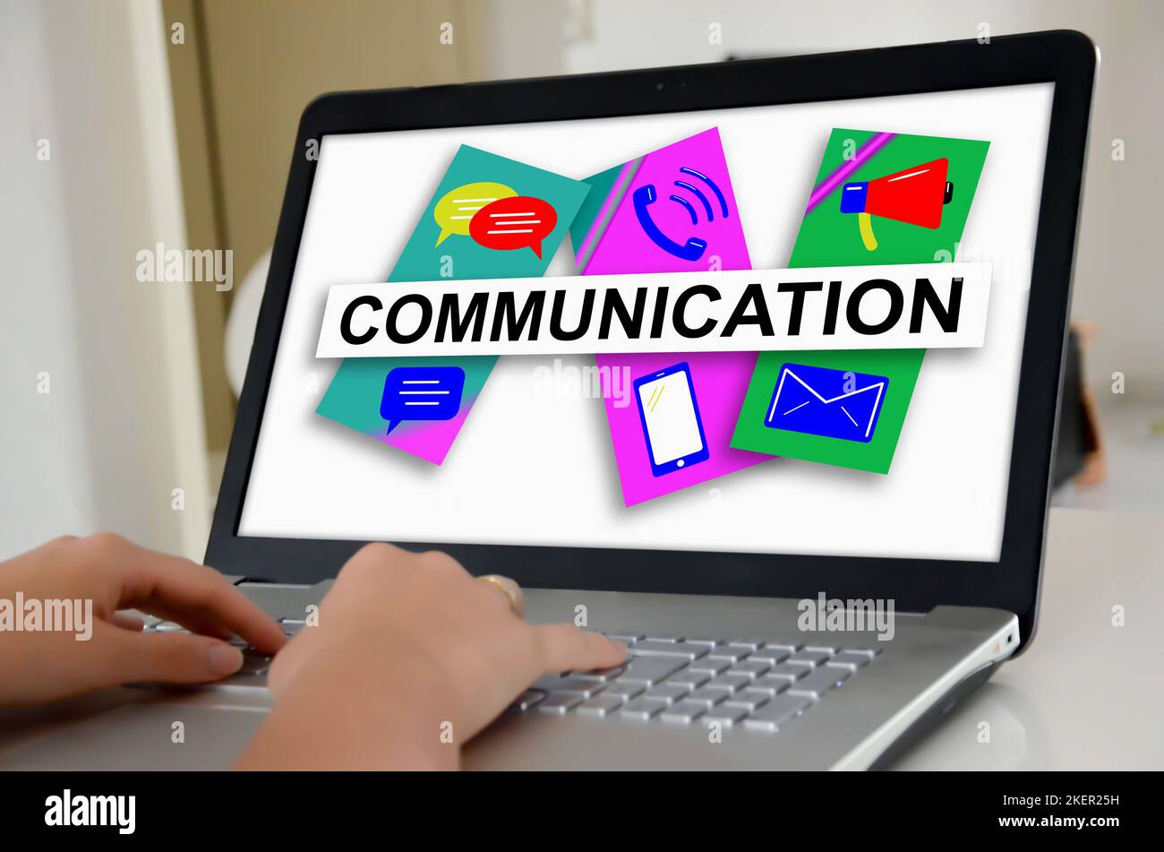 Hands on a laptop with screen showing communication concept Stock Photo ...