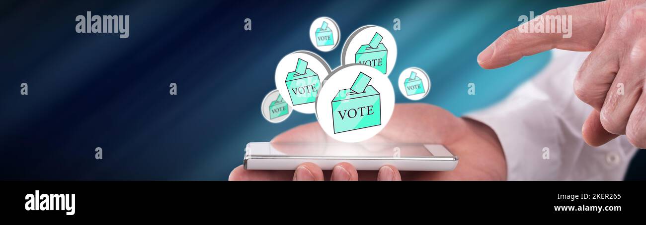 Vote concept above a smartphone held by a man Stock Photo - Alamy