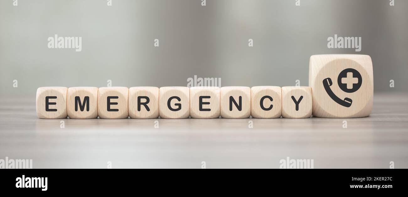 Wooden blocks with symbol of emergency concept Stock Photo - Alamy