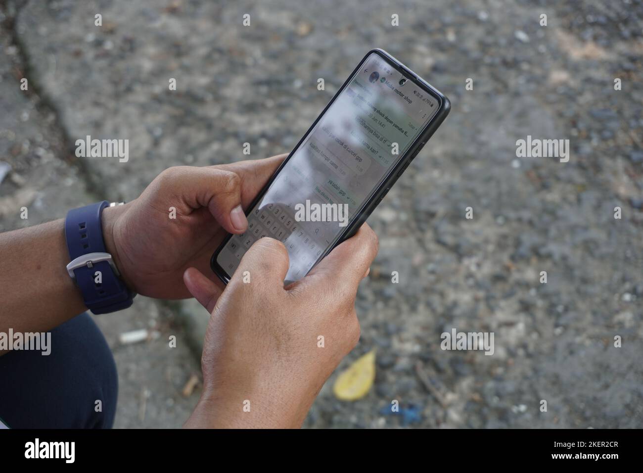 Close up business hand holding and operating smart phone device in the ...