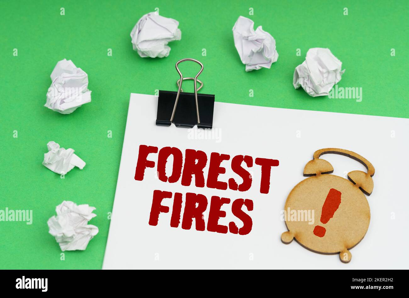 Environmental concept. On a green background there is a white sheet, on ...