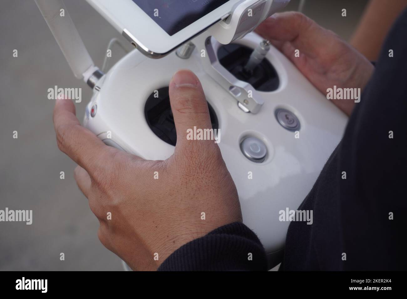 Closed up Hands holding drone controller. The hand operating the drone ...