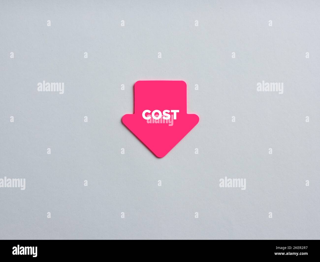 Business costs are falling down or decreasing. Arrow shaped note paper ...