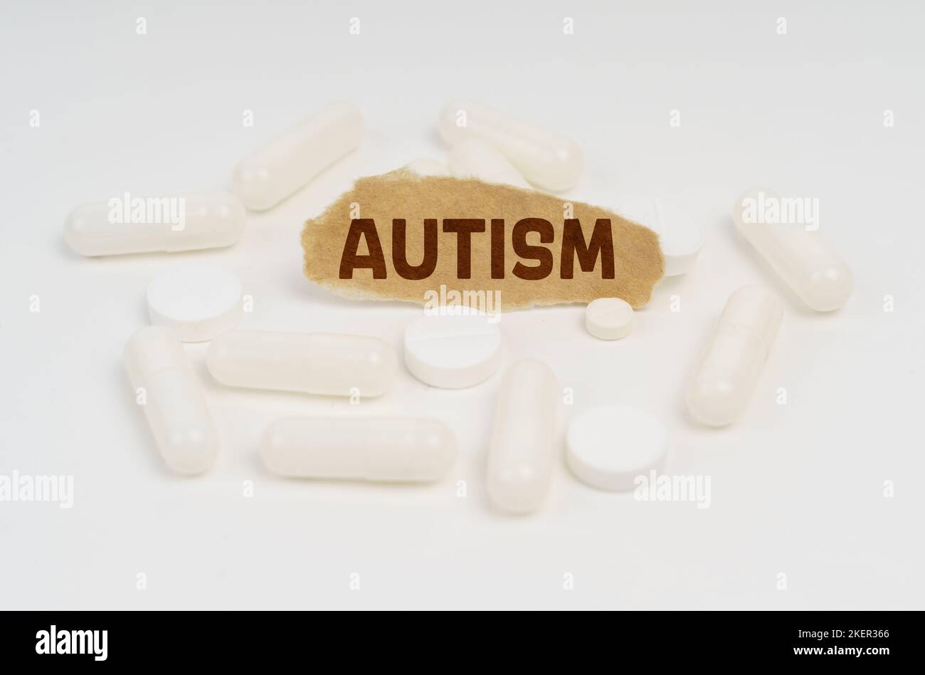 Medicine and health concept. On a white background pills and a piece of ...