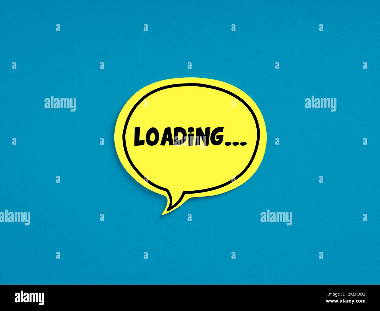 The word loading on yellow speech bubble on blue background. Technology ...