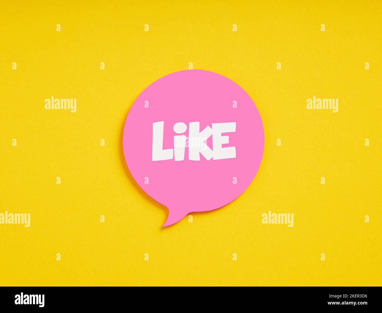 The word like on pink speech bubble on yellow background. Social media ...
