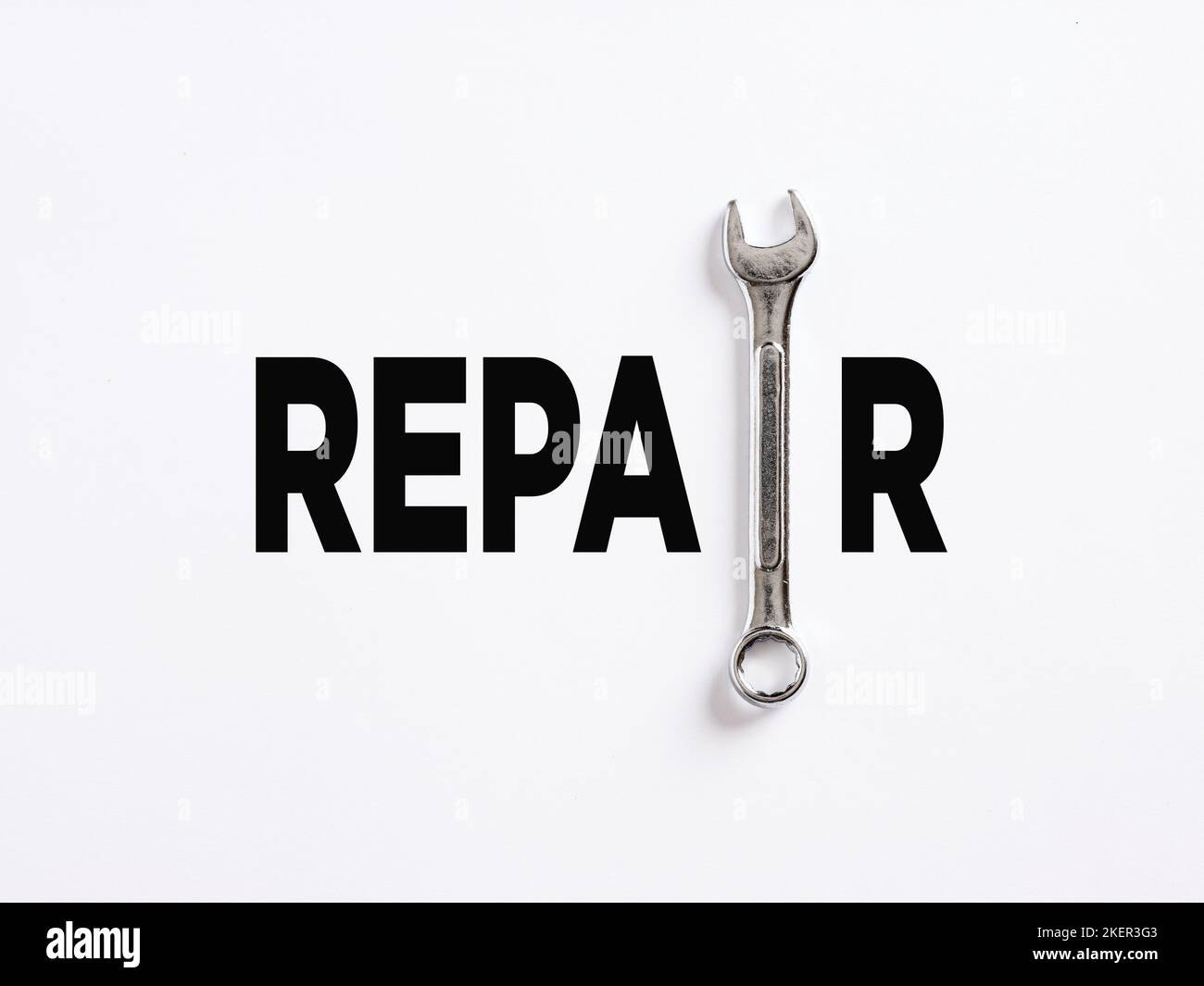 The word repair written with a wrench. To repair or fix something ...