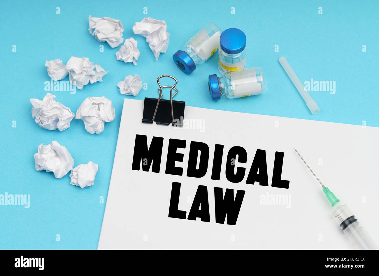 Medicine concept. On a blue background, a syringe, medicine, white ...