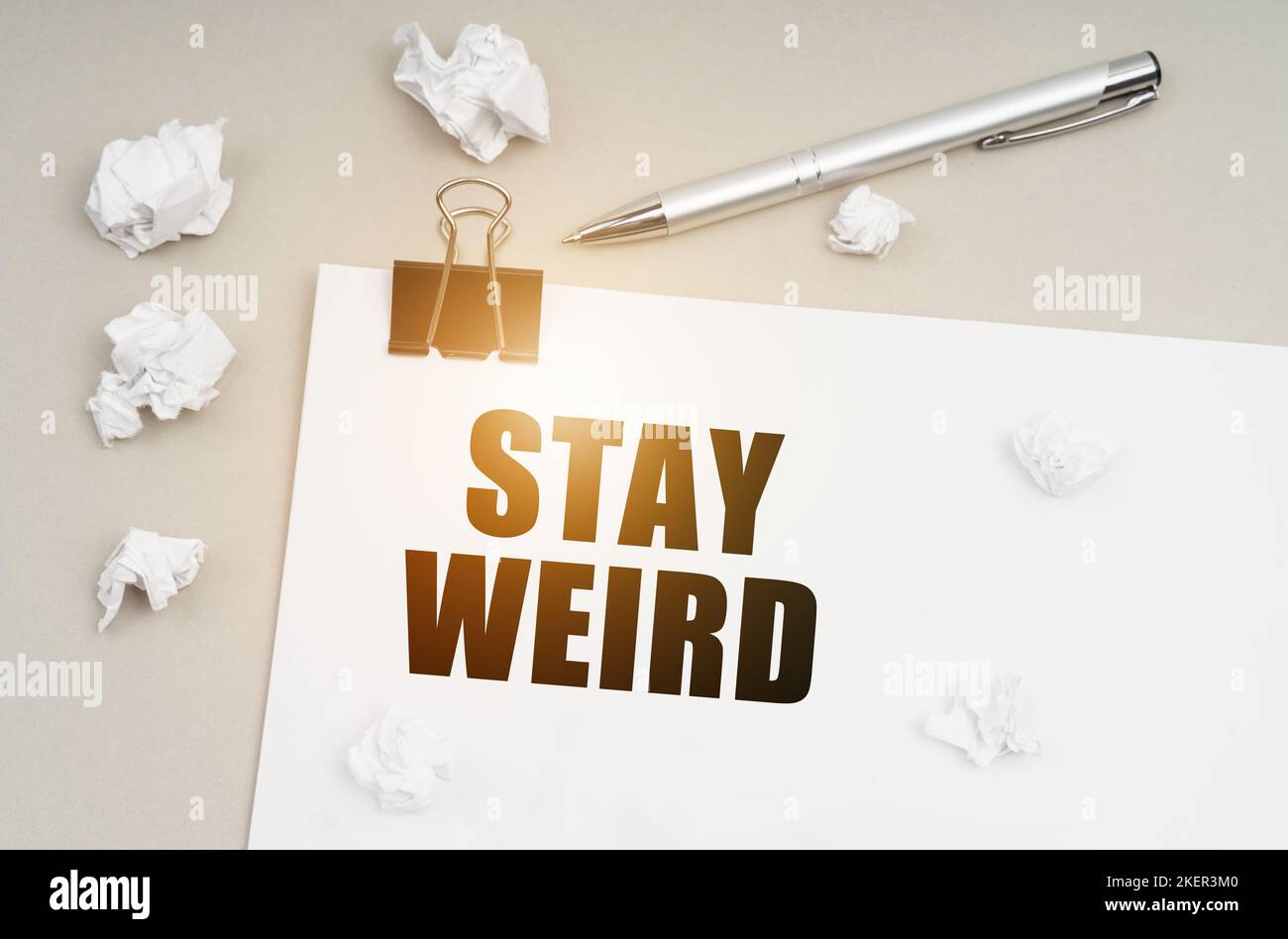 Economy and business concept. On a gray surface, a pen, crumpled paper ...