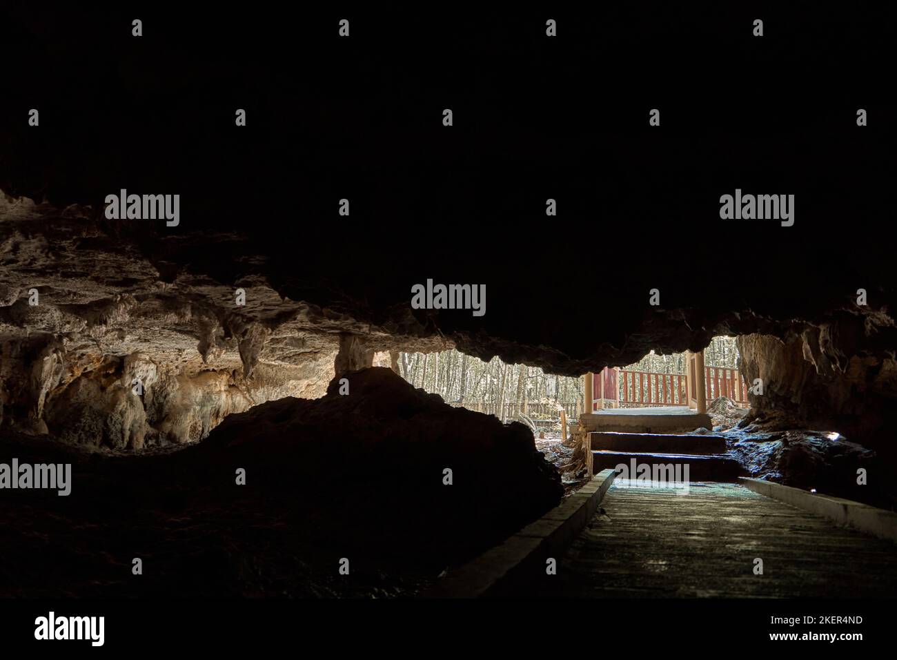 Old stone bat cave in the rock. Tourist attraction. Walk in the cave ...