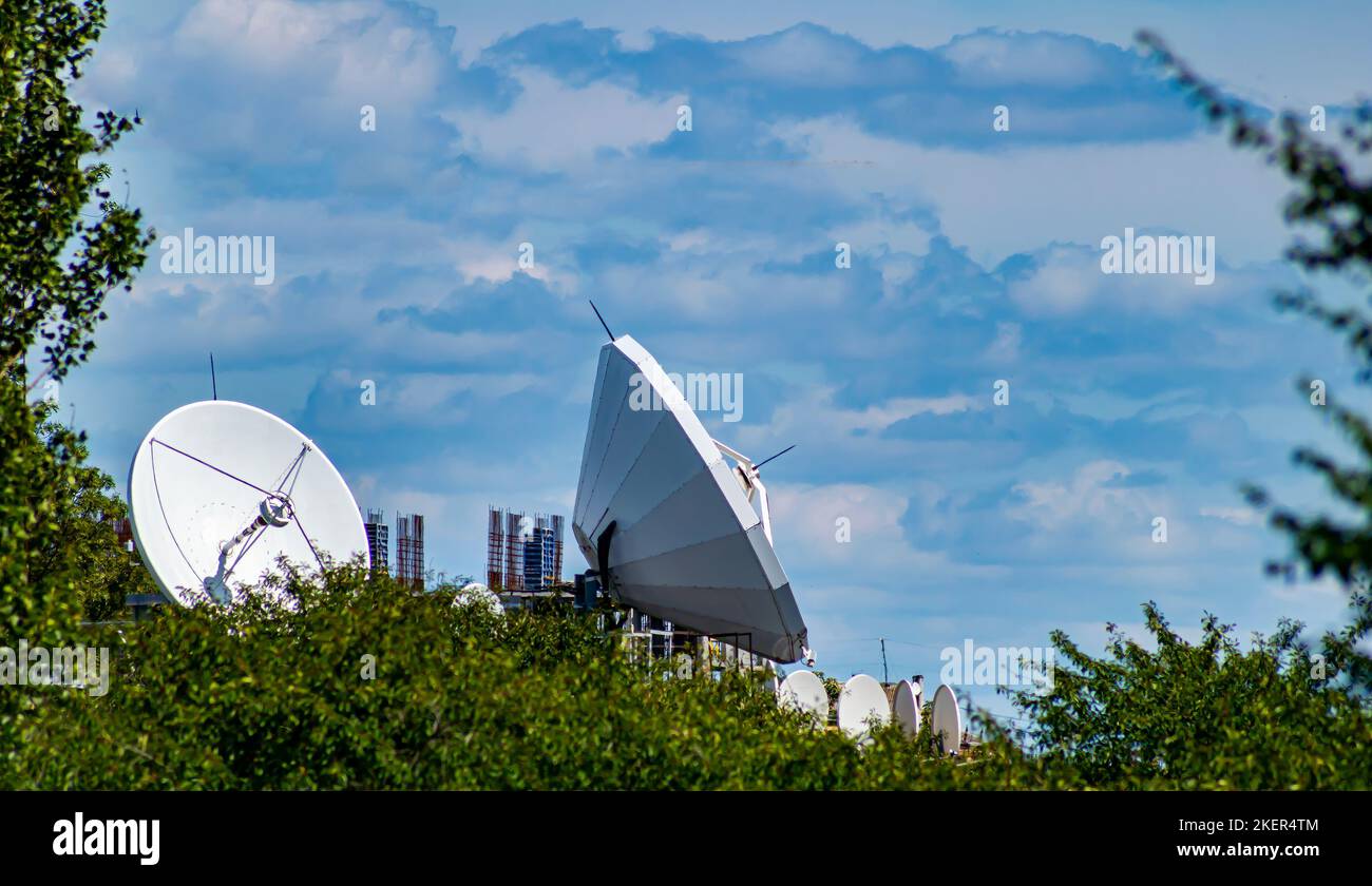 Large industrial satellite dishes for receiving and transmitting a ...