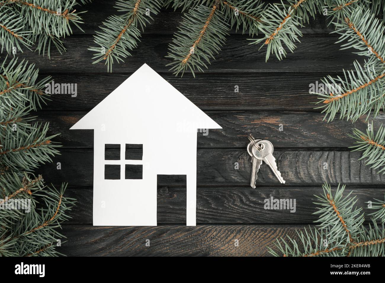 White paper house with keys as family christmas present, top view ...